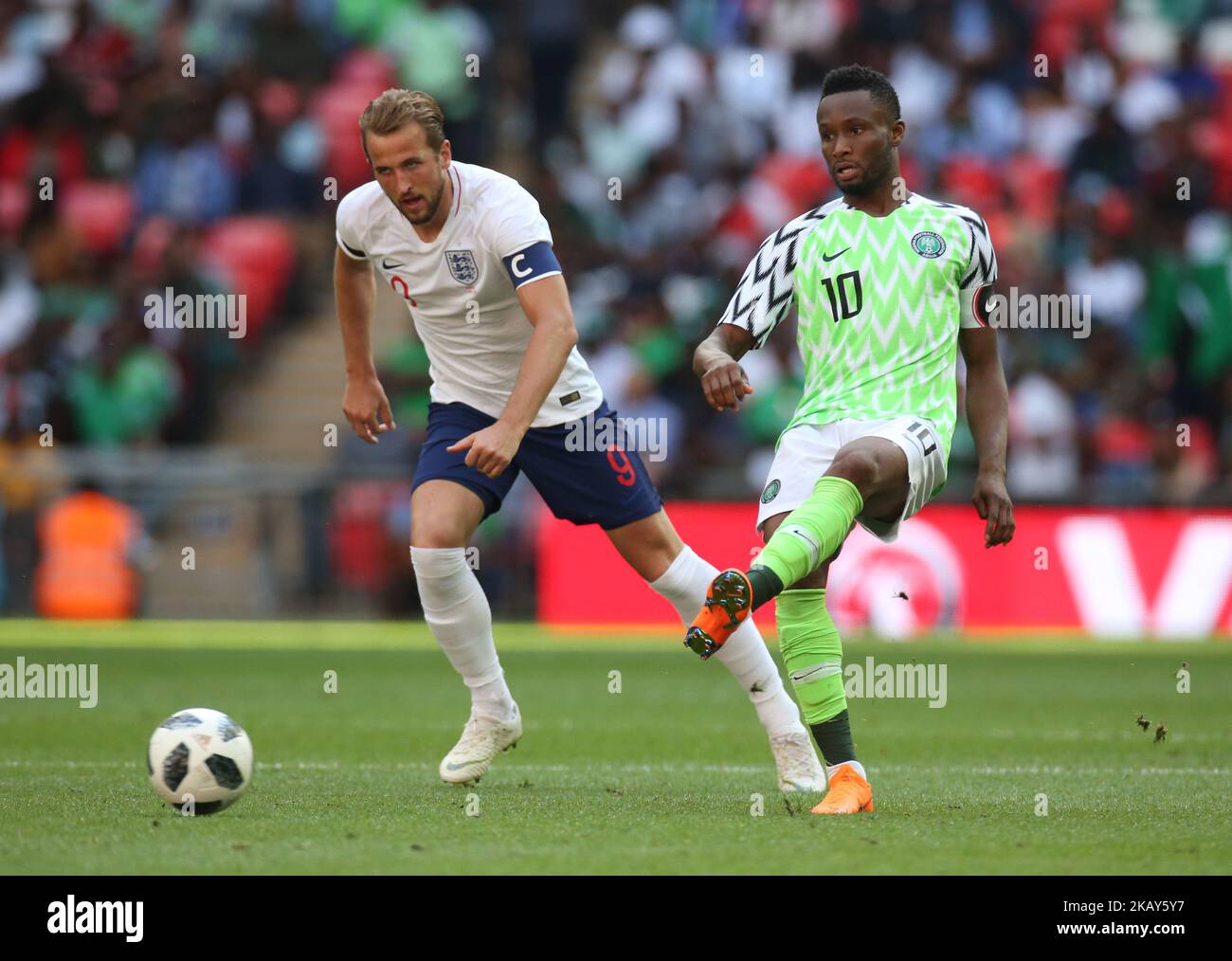 L-R England's Harry Kane and John Obi Mikel of Nigeria during ...
