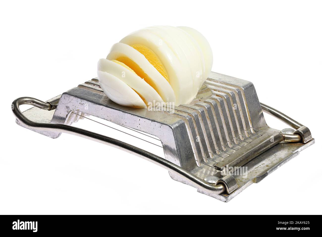 vintage aluminium egg slicer with hard-boiled chicken egg isolated on ...