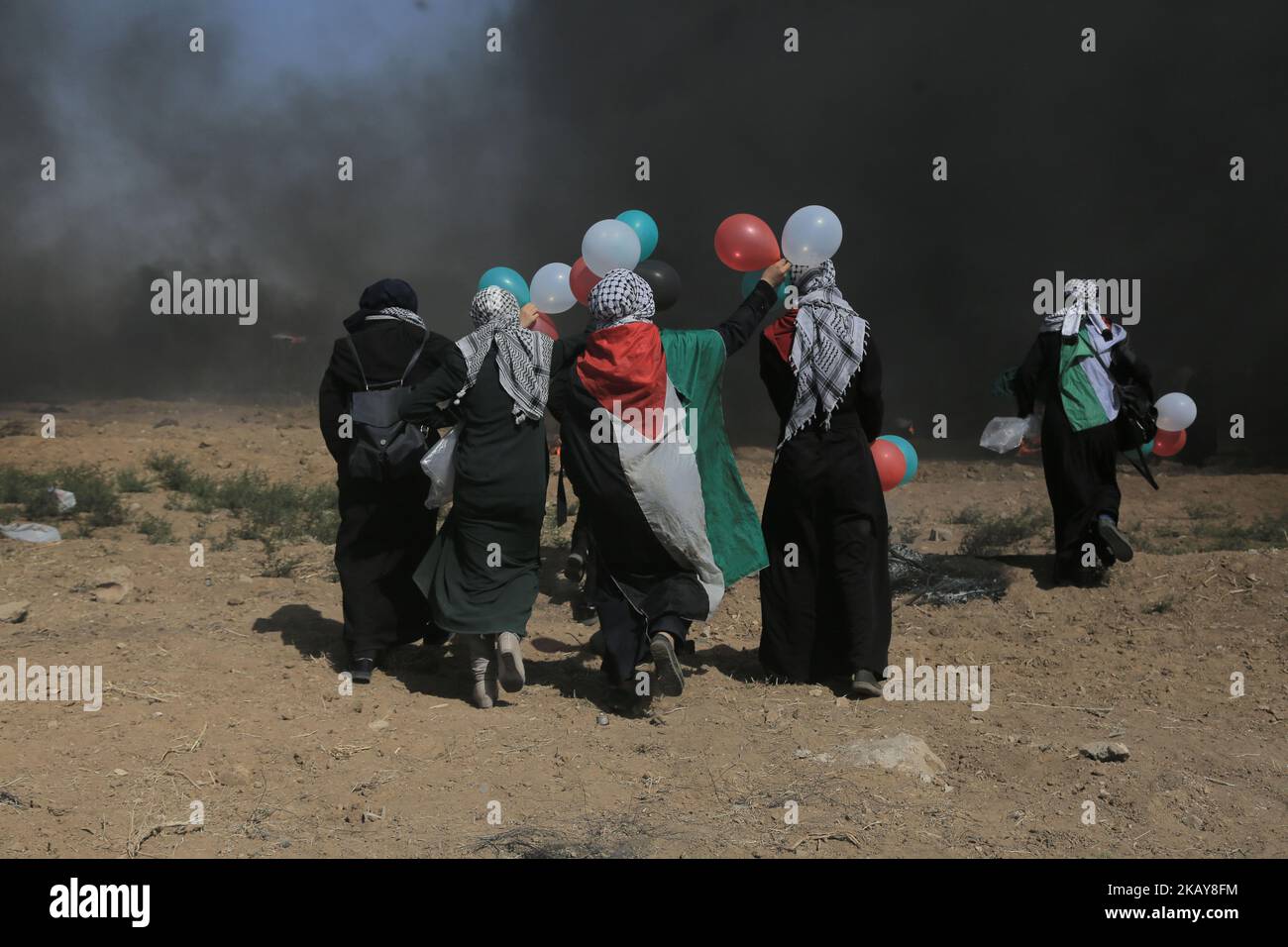 The mother of 21 years old Razan al-Najjar mourns during the funeral of ...