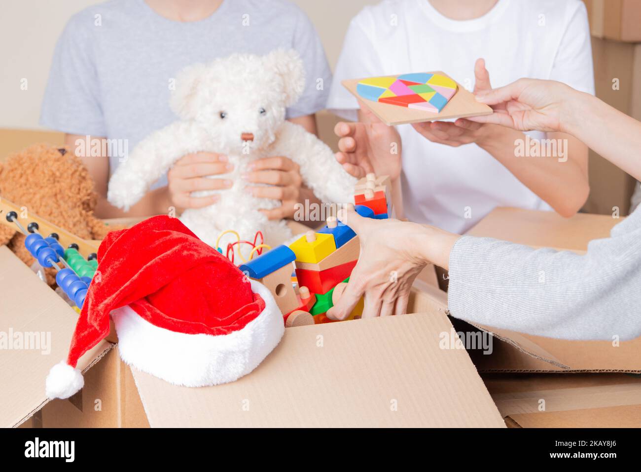 Christmas donation. Volunteers collect donations for charity indoors ...