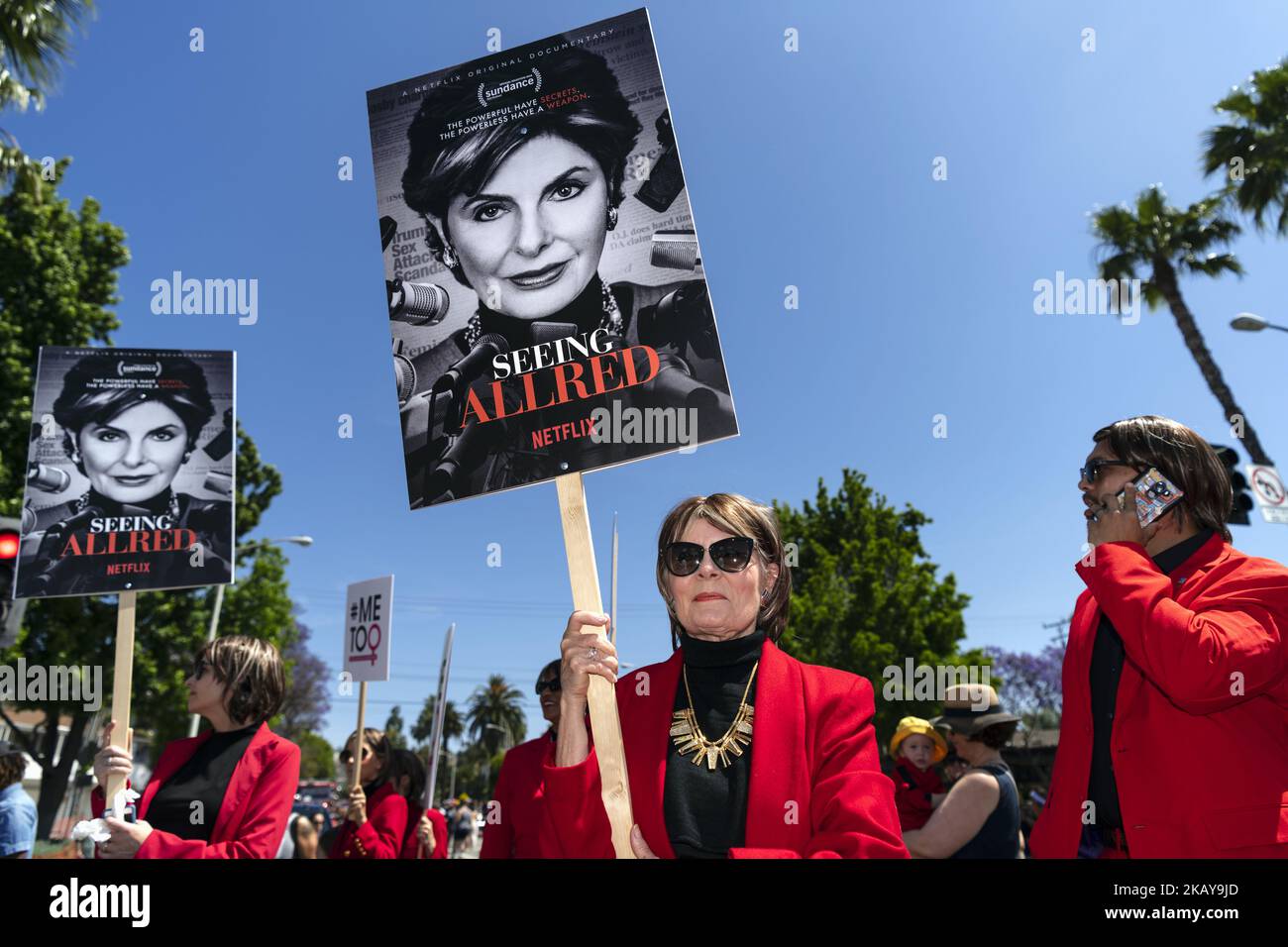 People dressed as attorney Gloria Allred participate in the LA Pride ...