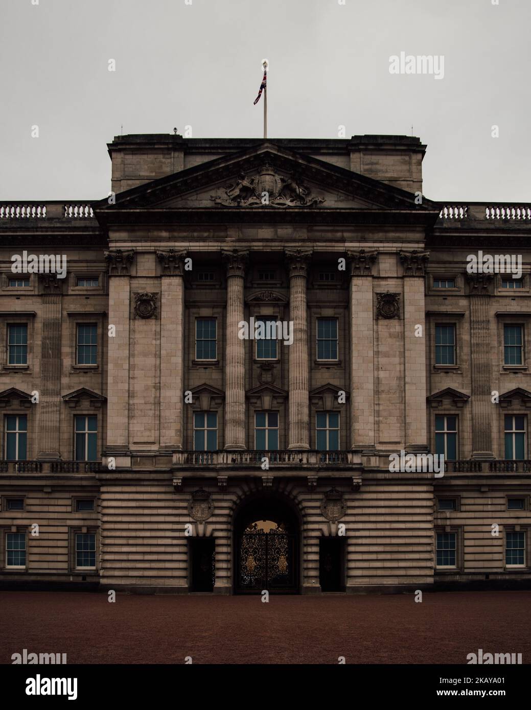 The vertical view of Buckingham Palace entrance exterior on a rainy day ...