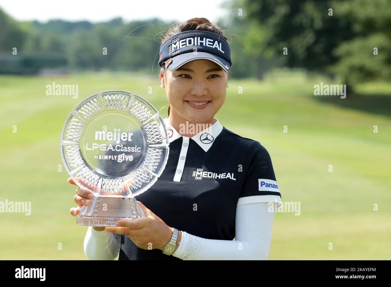 So Yeon Ryu of Korea holds up the trophy after winning the Meijer LPGA ...