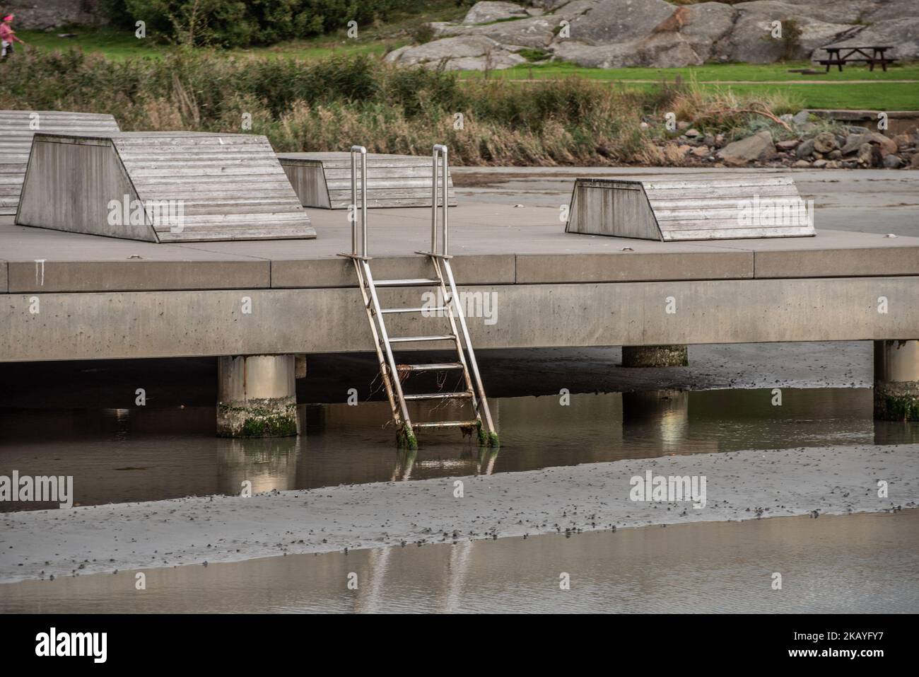 Ladder into the water from a pier Stock Photo - Alamy
