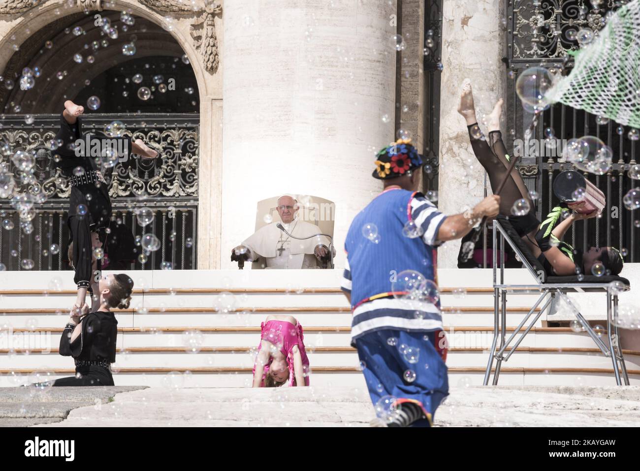 Pope Francis observes the spectacle of the aquatic circus, during the ...