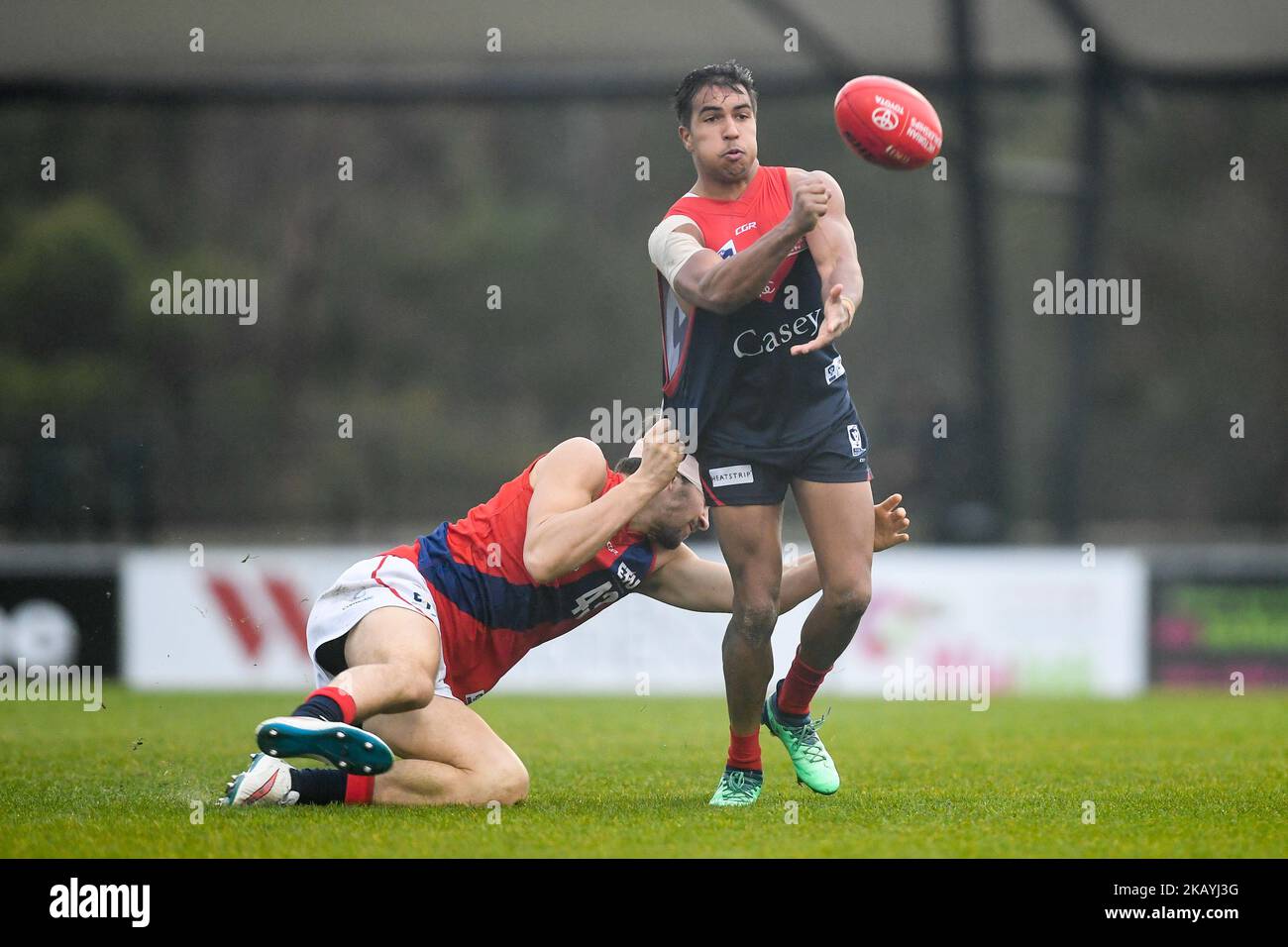 Jay Kennedy-Harris of the Casey Demons passes the ball during the VFL ...