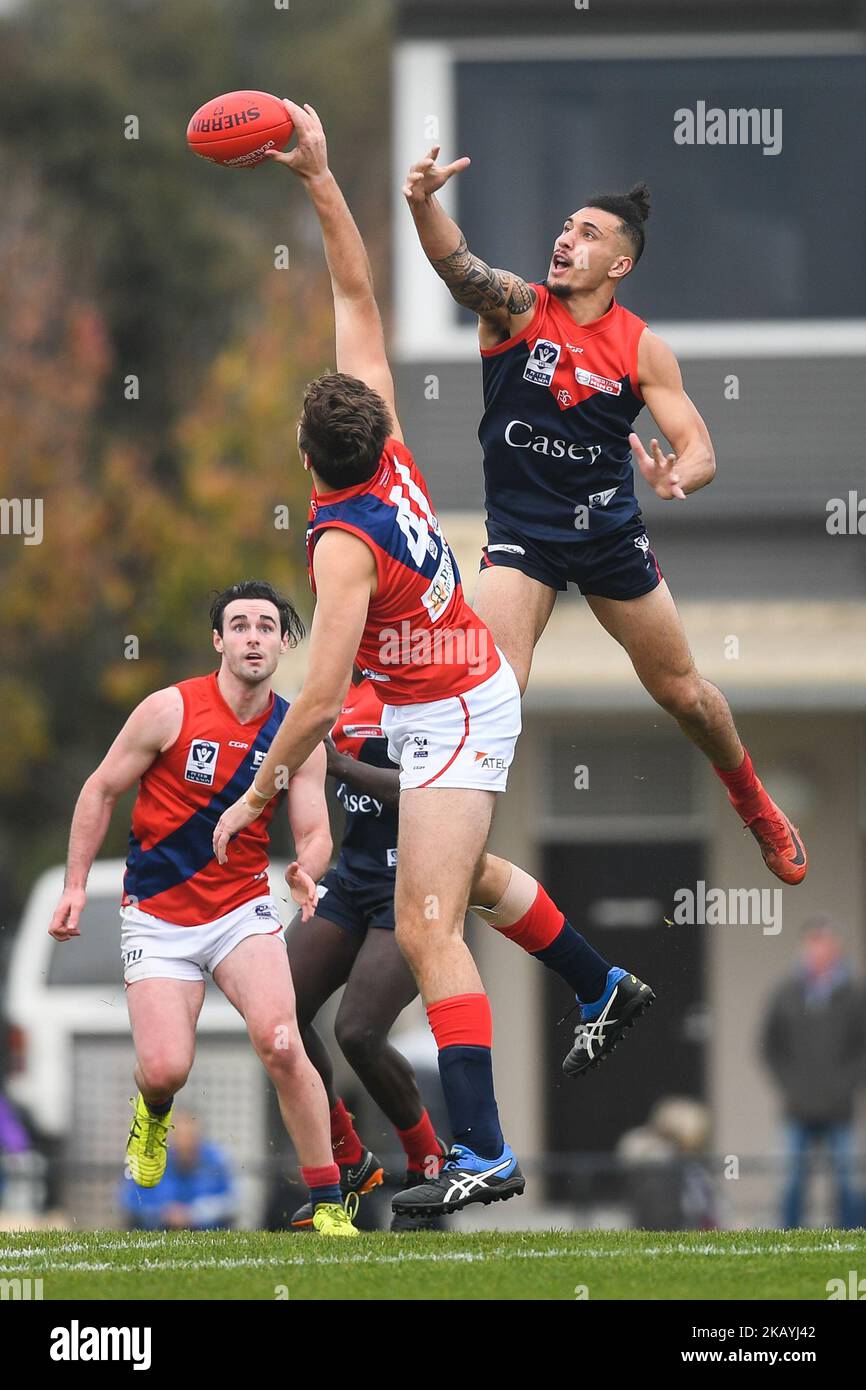 Mykelti Lefau of the Casey Demons and Mark Kovacevic of Coburg battle ...