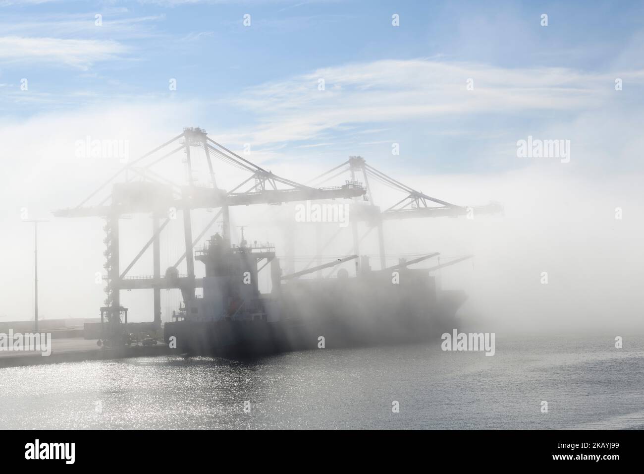 Container ship in port, strong fog. Foggy weather. Bad visibility Stock ...