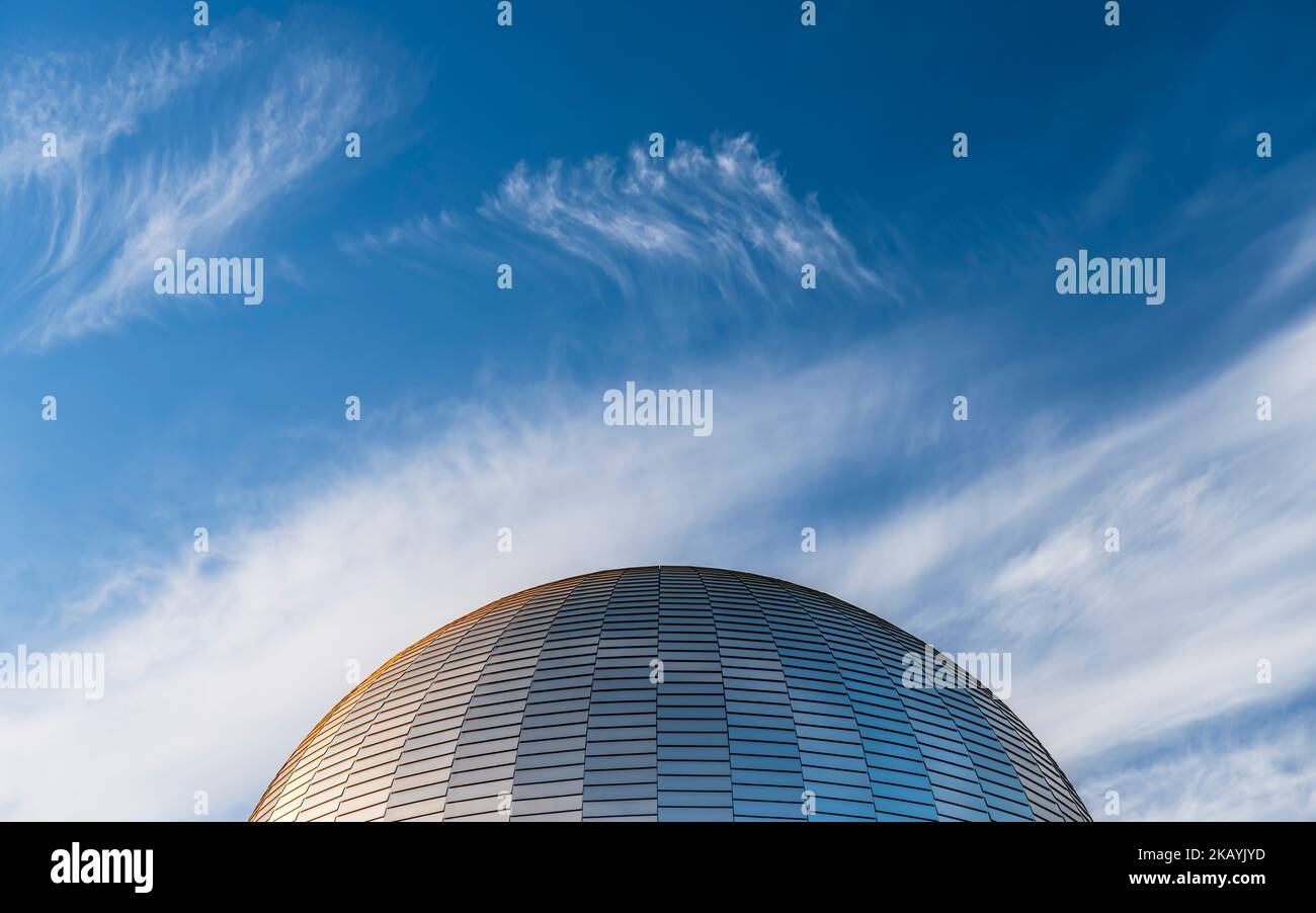 The dome of the Silesian planetarium shining in the light of the ...