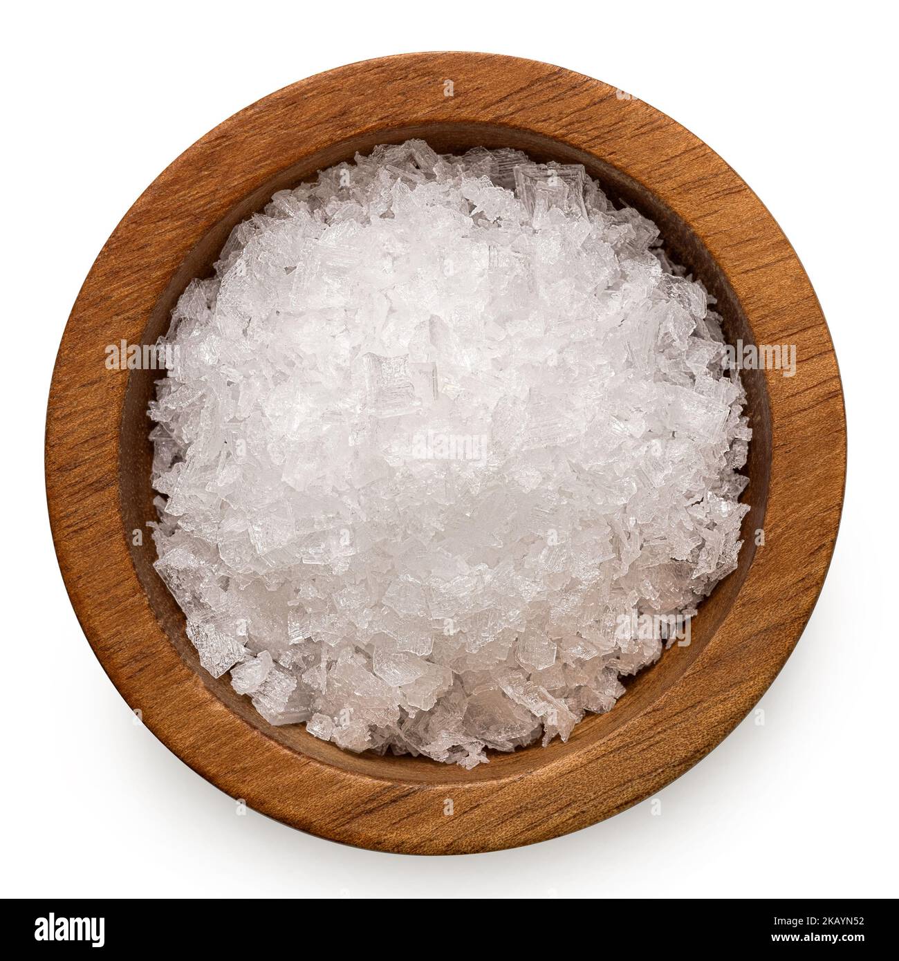 Sea salt flakes in a wood bowl isolated on white. Top view Stock Photo ...