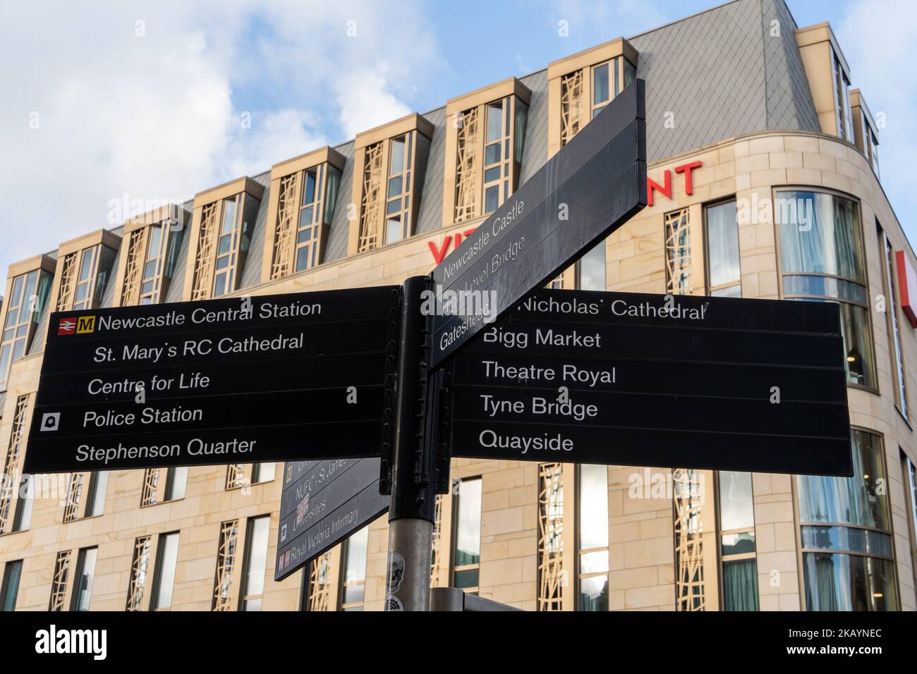 A signpost in the city of Newcastle upon Tyne, UK gives directions to ...