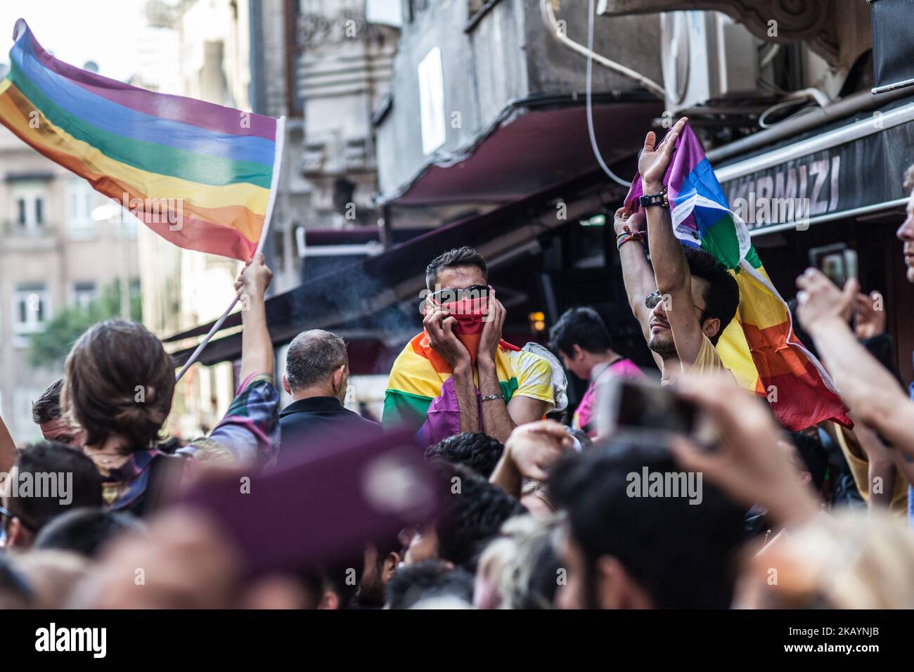 LGBT activists shout slogans and hold rainbow flags as they take part ...