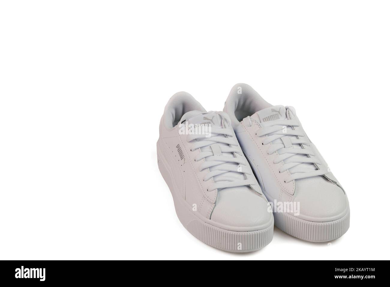 Close up view of white Puma sneakers isolated on white background ...