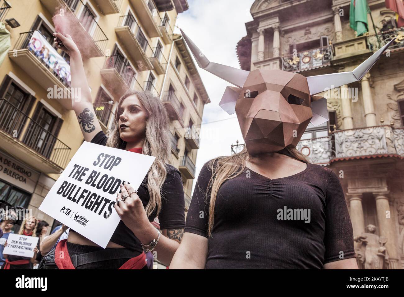 Activist against animal cruelty in bull fightings wears a paperboard ...
