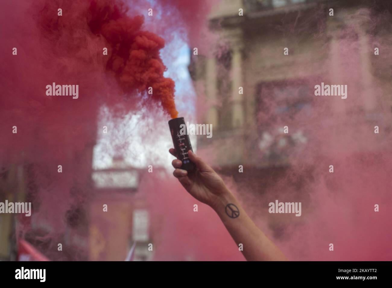 Detail of a red flare worn by a member of the PETA collective during ...