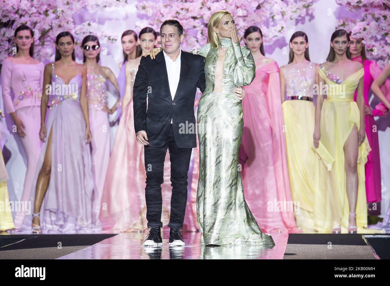 Model Judith Masco and designer Hannibal Laguna walks the runway at the ...