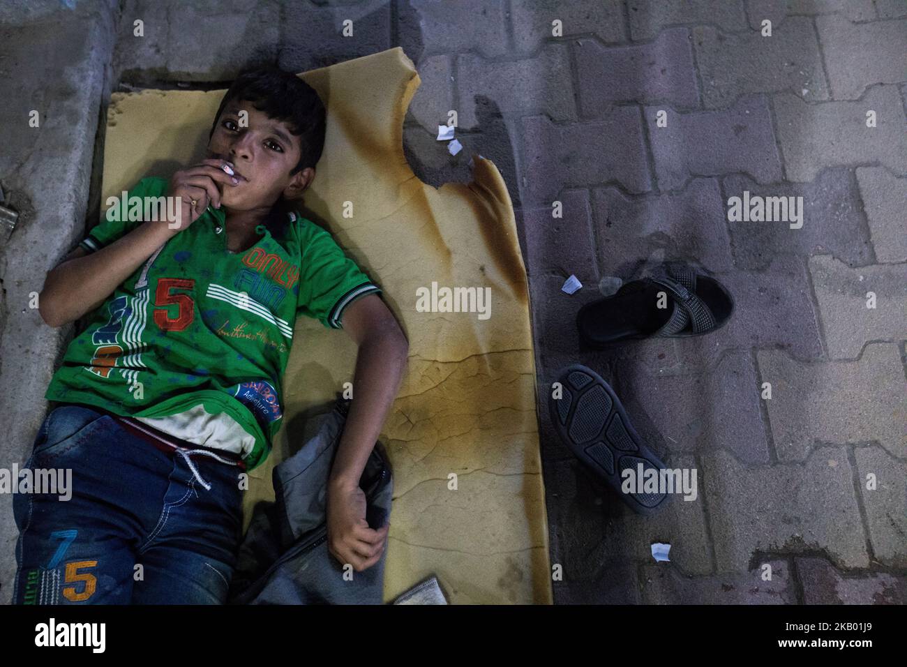 A homeless boy at his sleeping place on a street in Qamishli / Syria ...