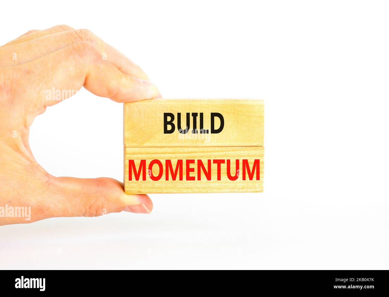 Build momentum symbol. Concept words Build momentum on wooden blocks ...