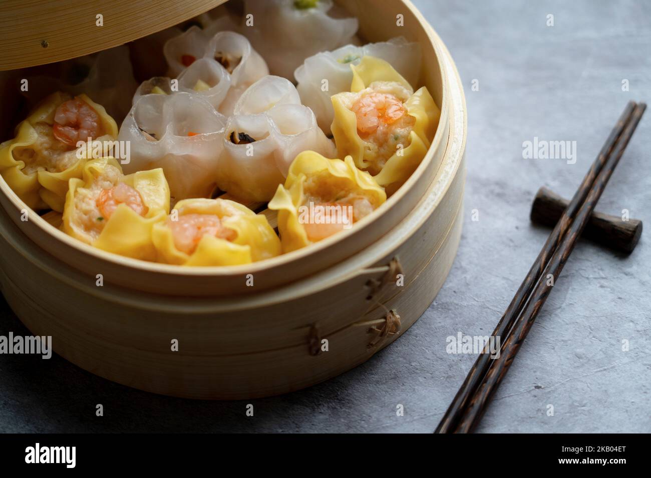 Dim Sum mix steamed in bamboo wood basket.large range of small Chinese ...