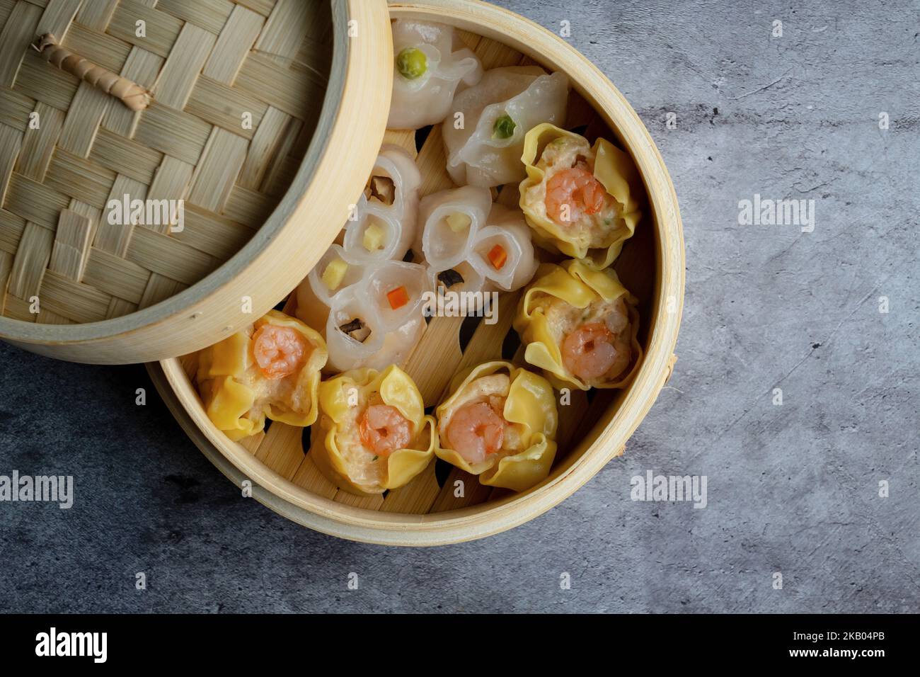 Dim Sum mix steamed in bamboo wood basket.large range of small Chinese ...