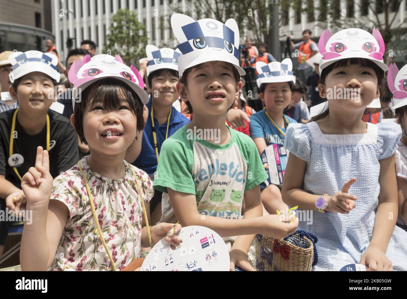 Children attend the debut event of the Tokyo 2020 Olympics Games ...