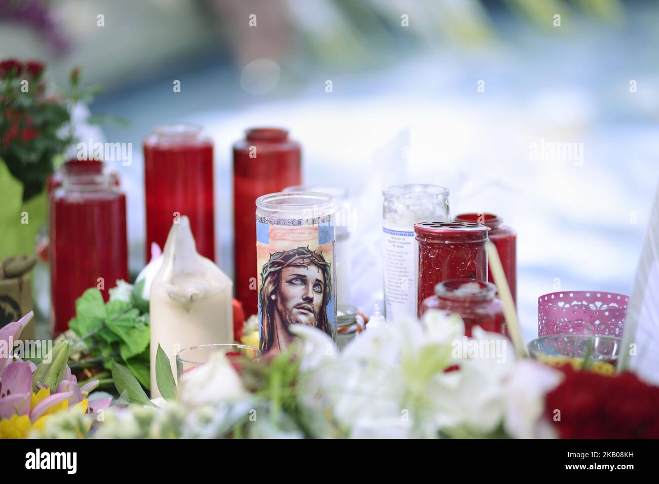 A candle with image of Jesus Christ in the memorial during the visit of ...