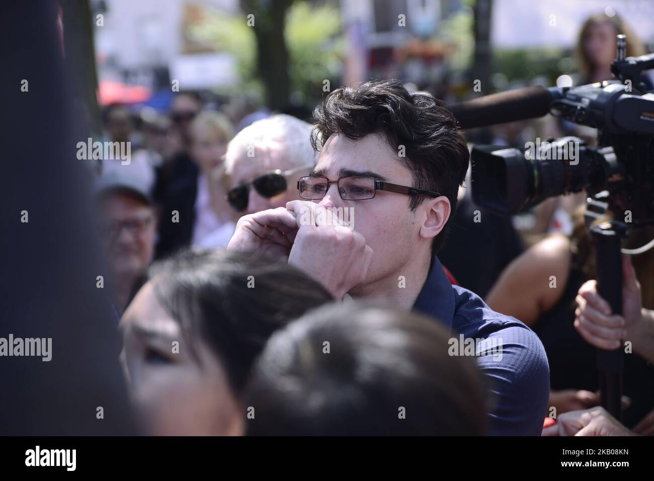 A person shouting anti- Trudeau slogans while Prime Minister Justin ...