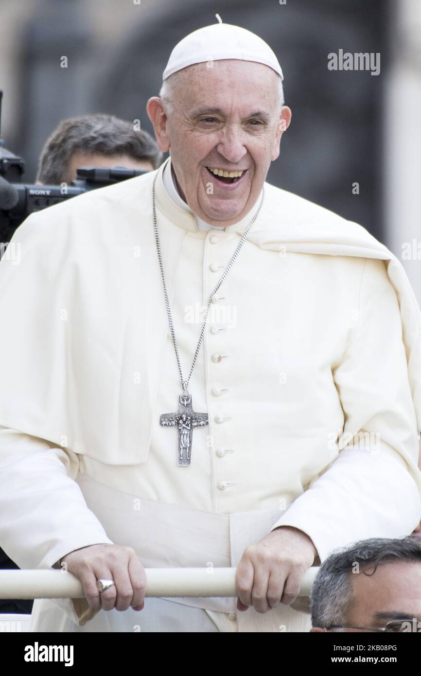 Pope Francis arrives in St. Peter Square to attends the audience with ...
