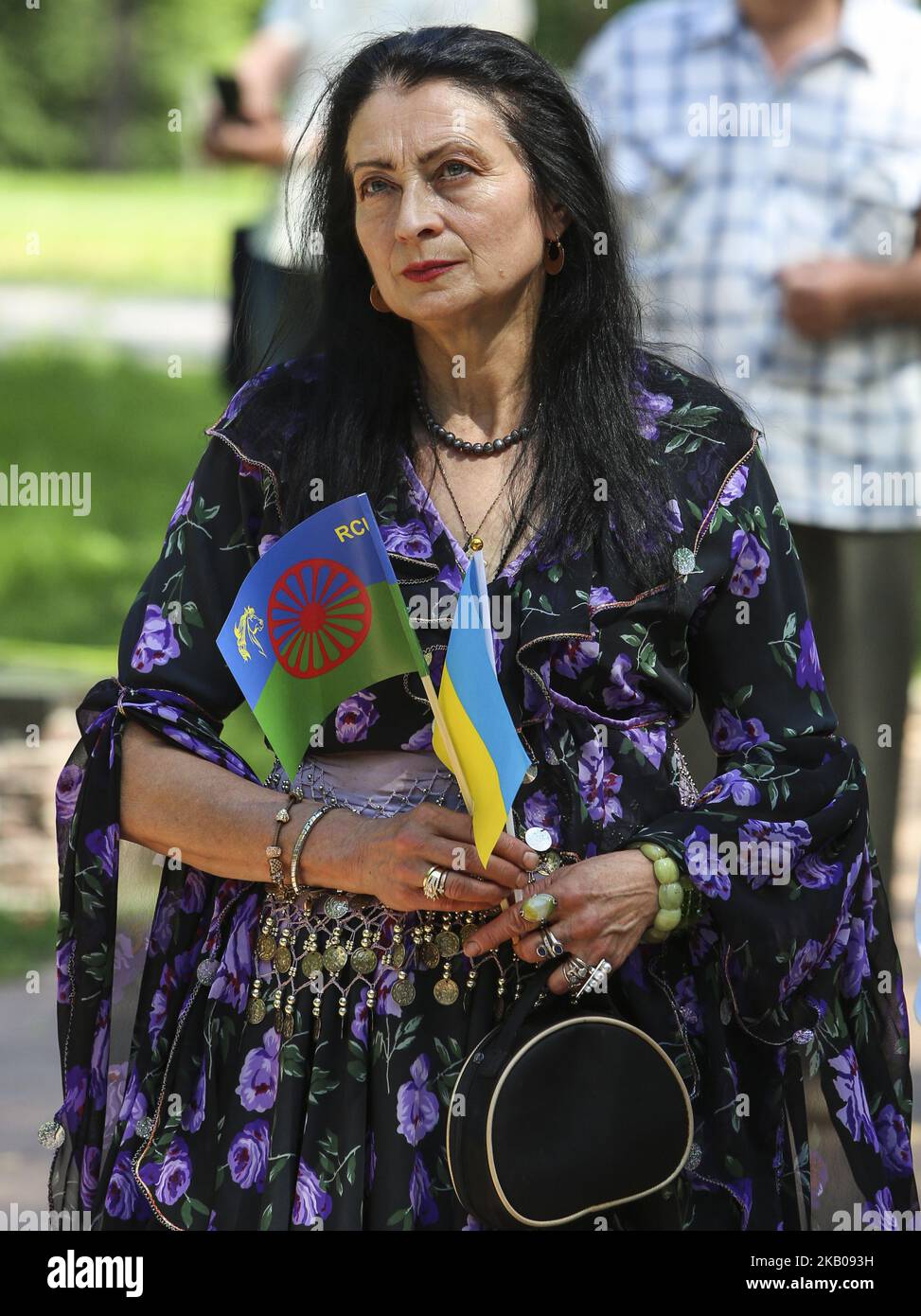 A Romani woman in traditional clothes attends a remembrance ceremony at ...