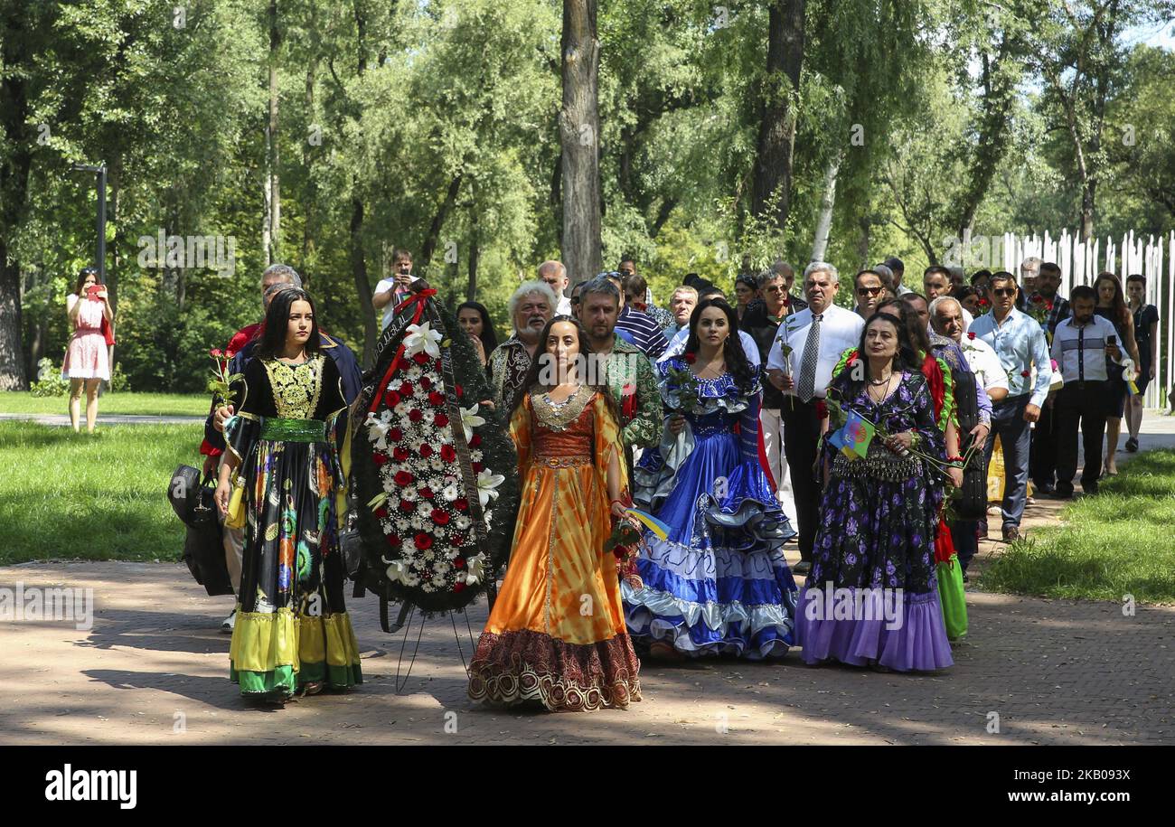 Romani people in traditional clothes attend a remembrance ceremony at ...