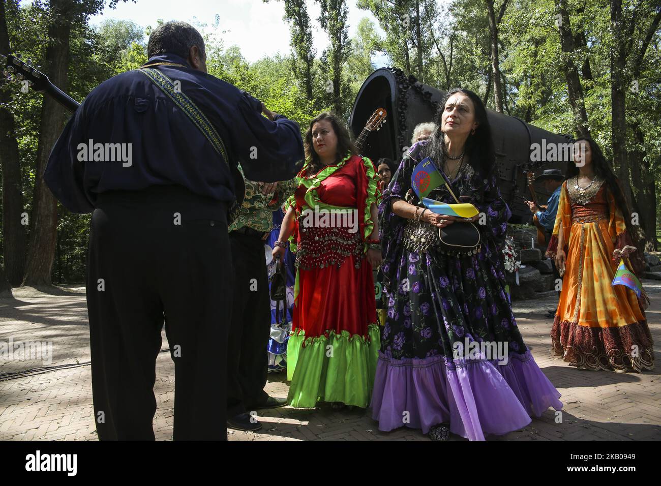 Romani people attend a remembrance ceremony at the Nomad-caravan ...