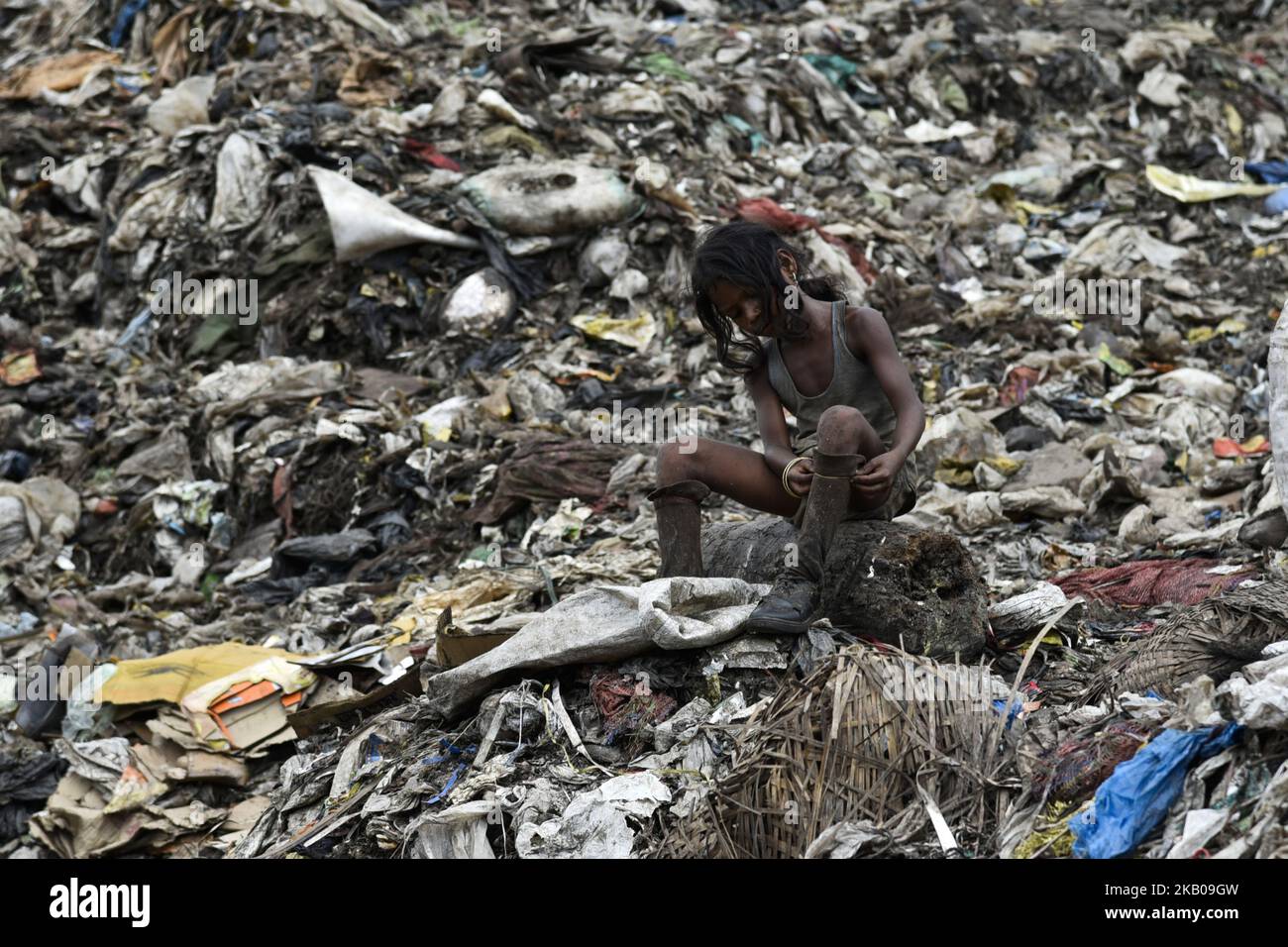 A child ragpicker at one of the largest disposal sites in the north ...