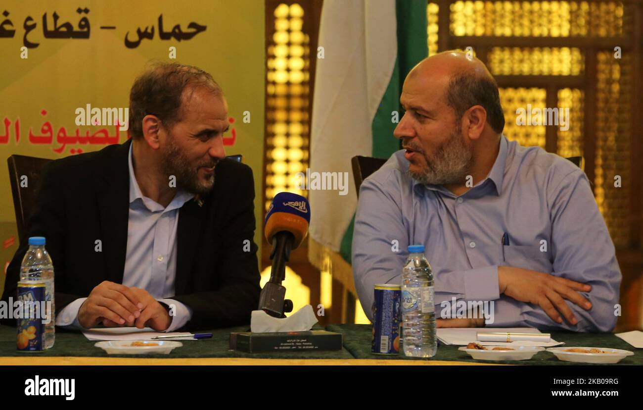 Hamas officials Husam Badran (C) and Khalil al-Hayya (2nd-R) attend a ...