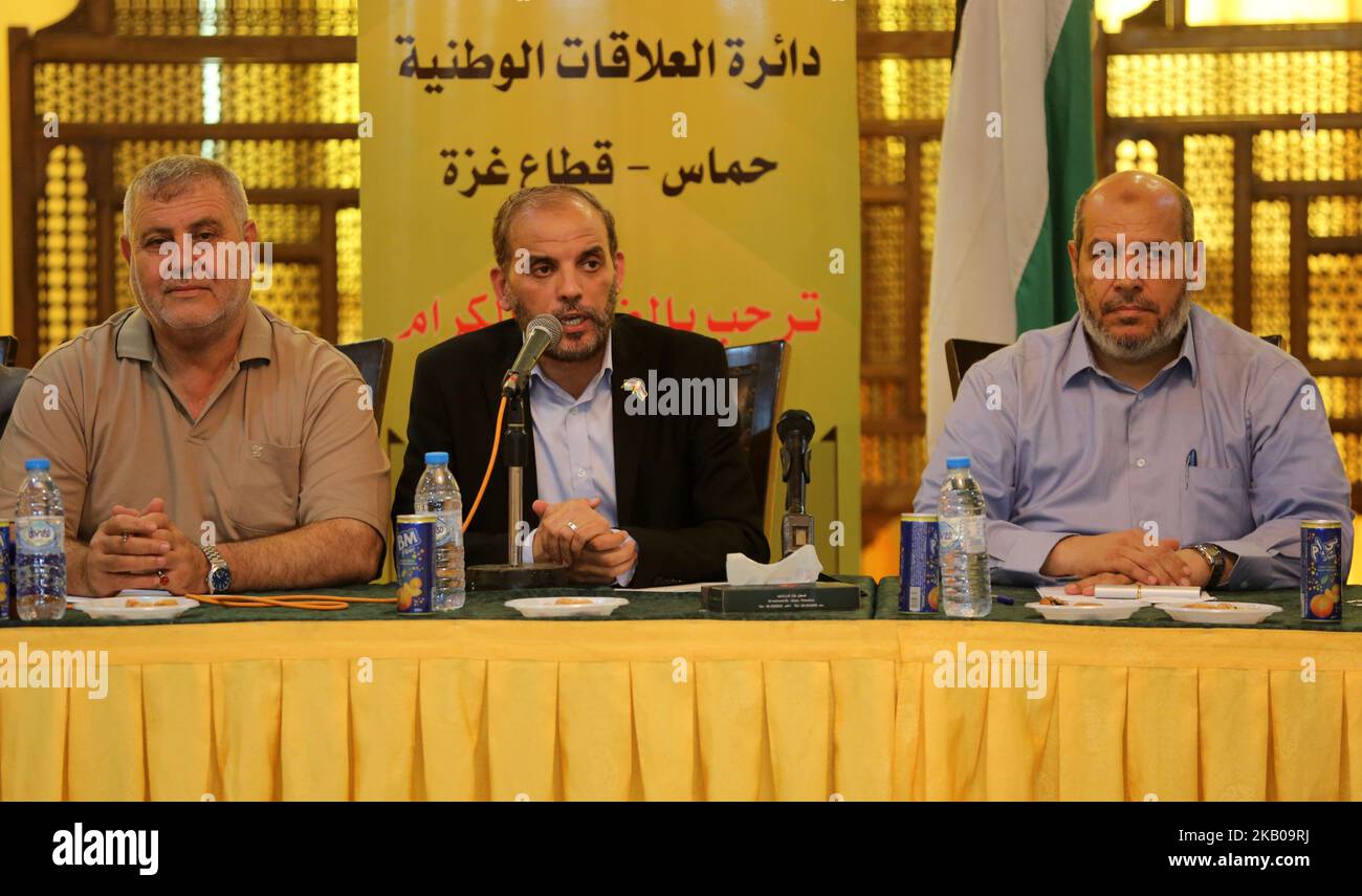 Hamas officials Husam Badran (C) and Khalil al-Hayya (2nd-R) attend a ...