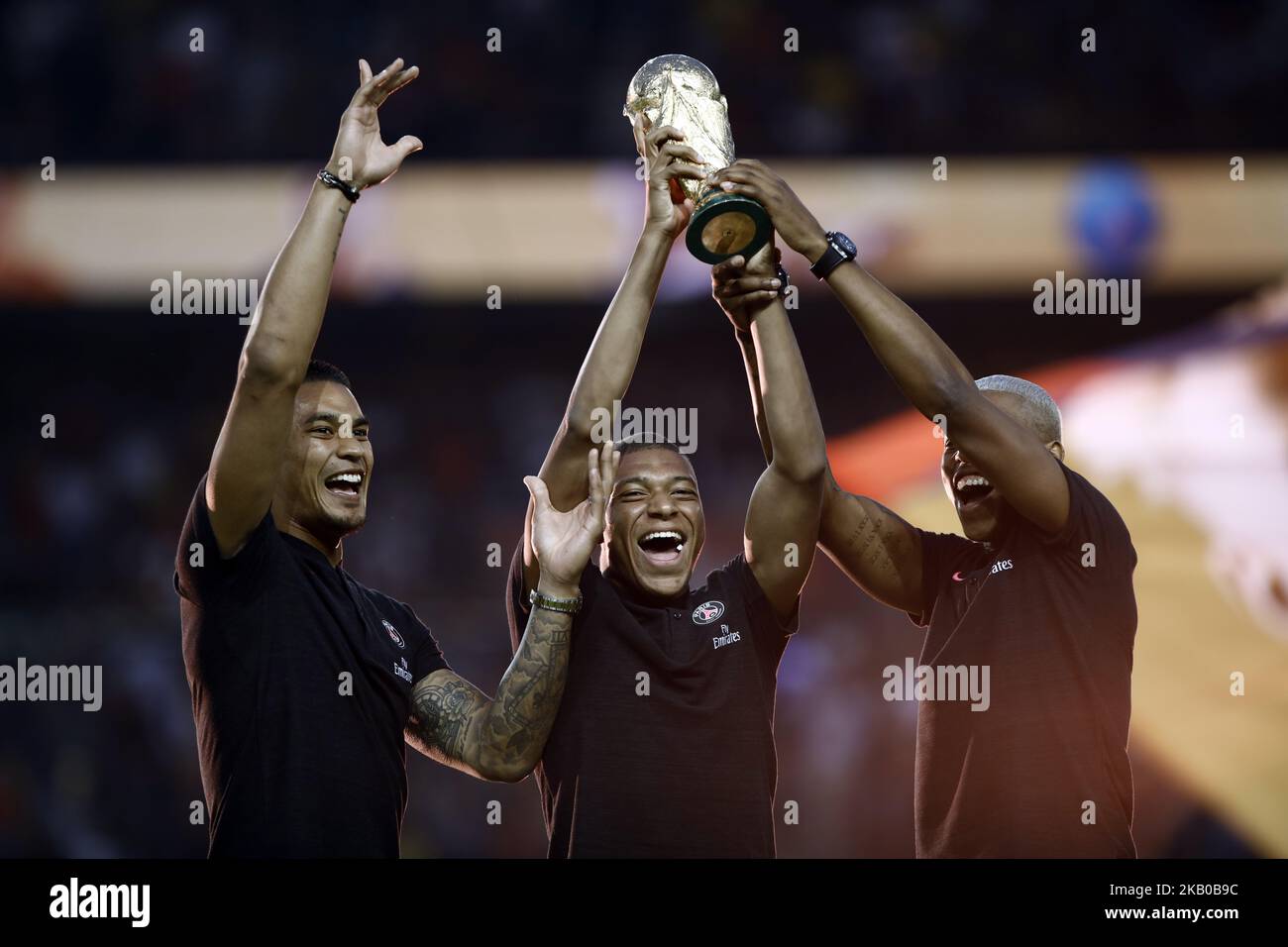 Kylian Mbappe, Alphonse Areola, Presnel Kimpembe poses and holds the ...