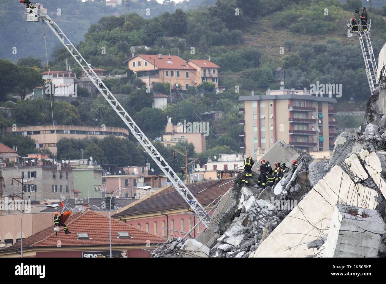 The remains of the Morandi motorway bridge stands after it partially ...
