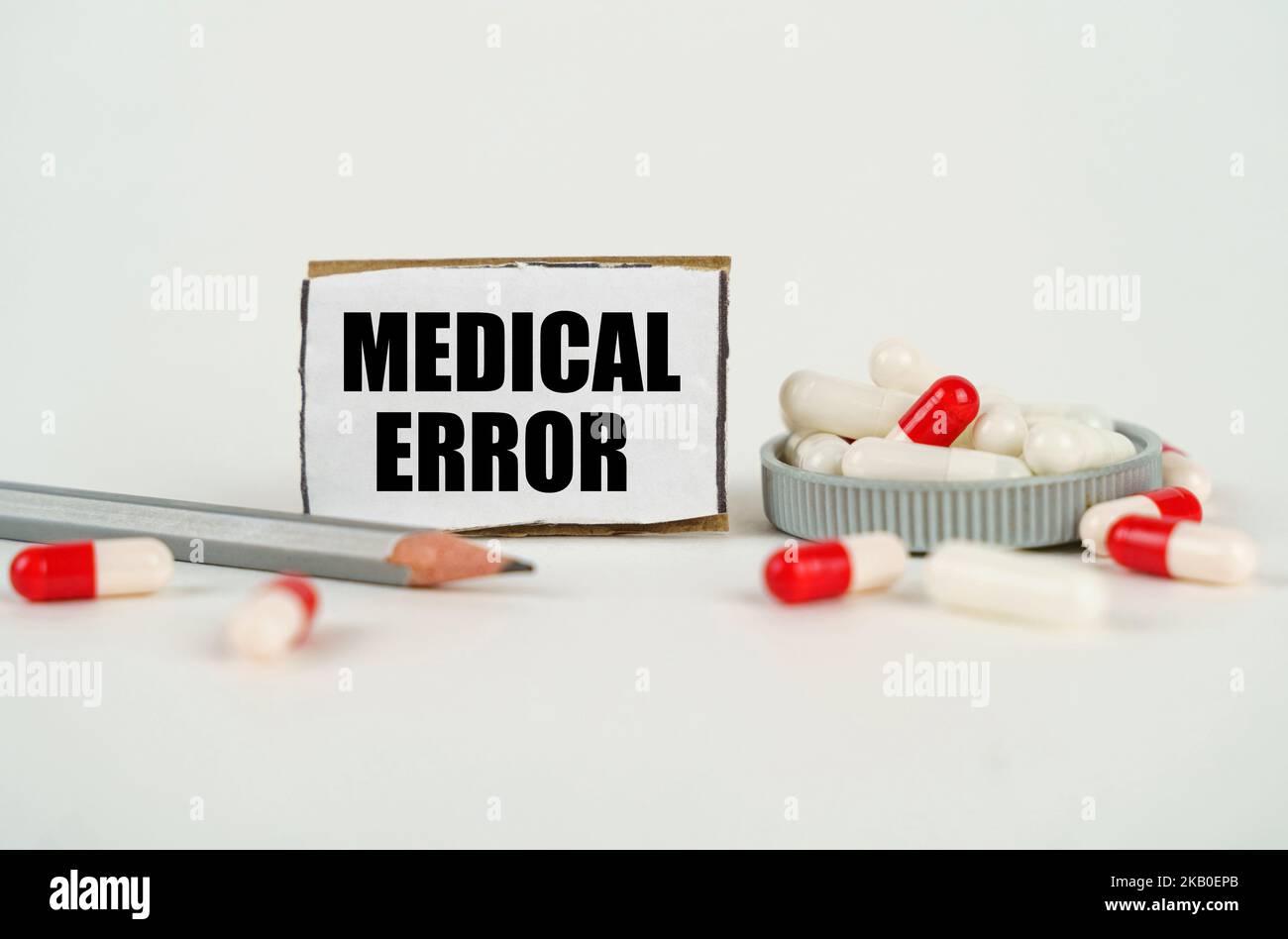 Medical concept. On a white background, medical capsules, a pencil and ...