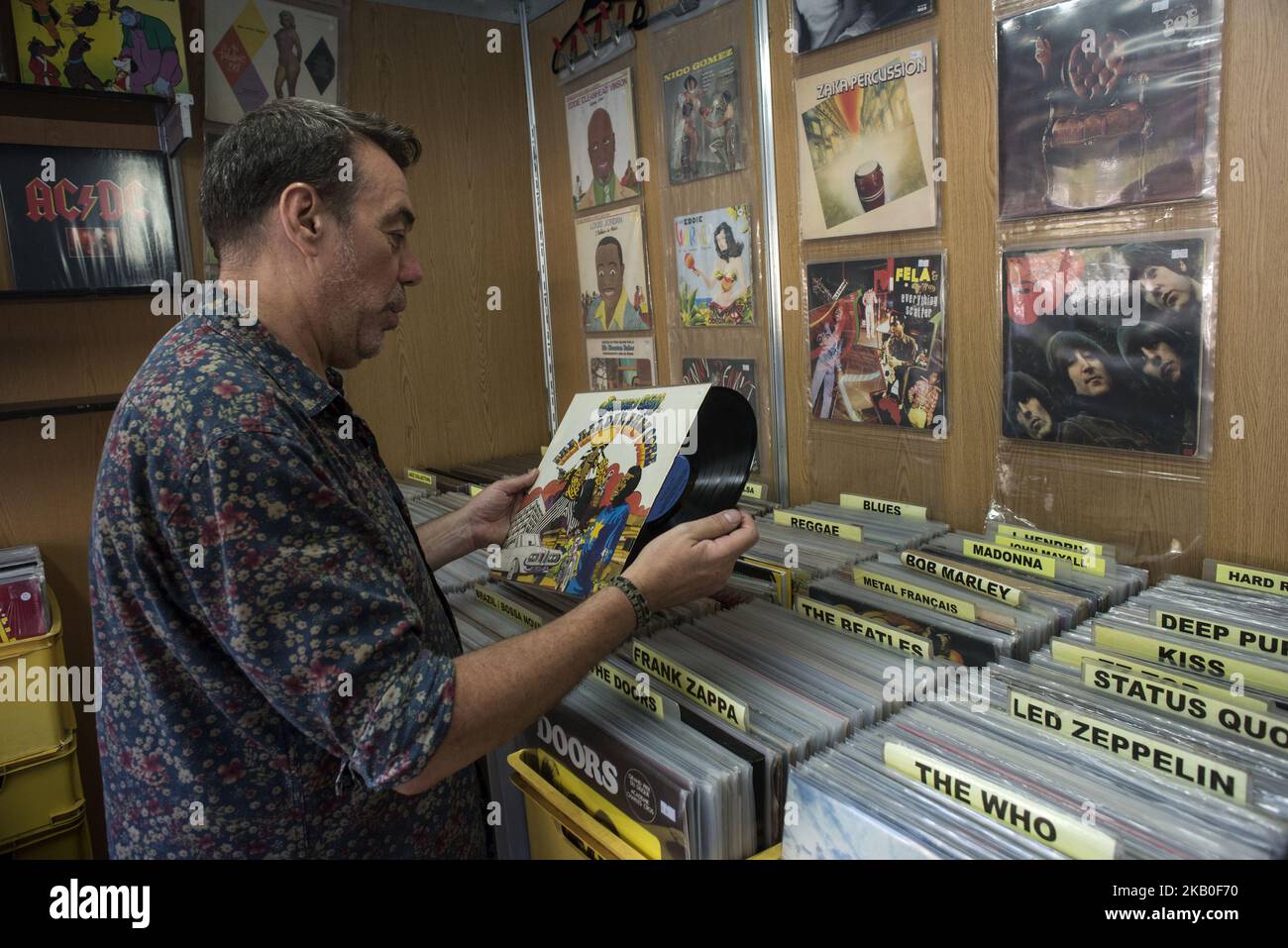 A collector prepares to buy a Cliff jimmy album at the III ...