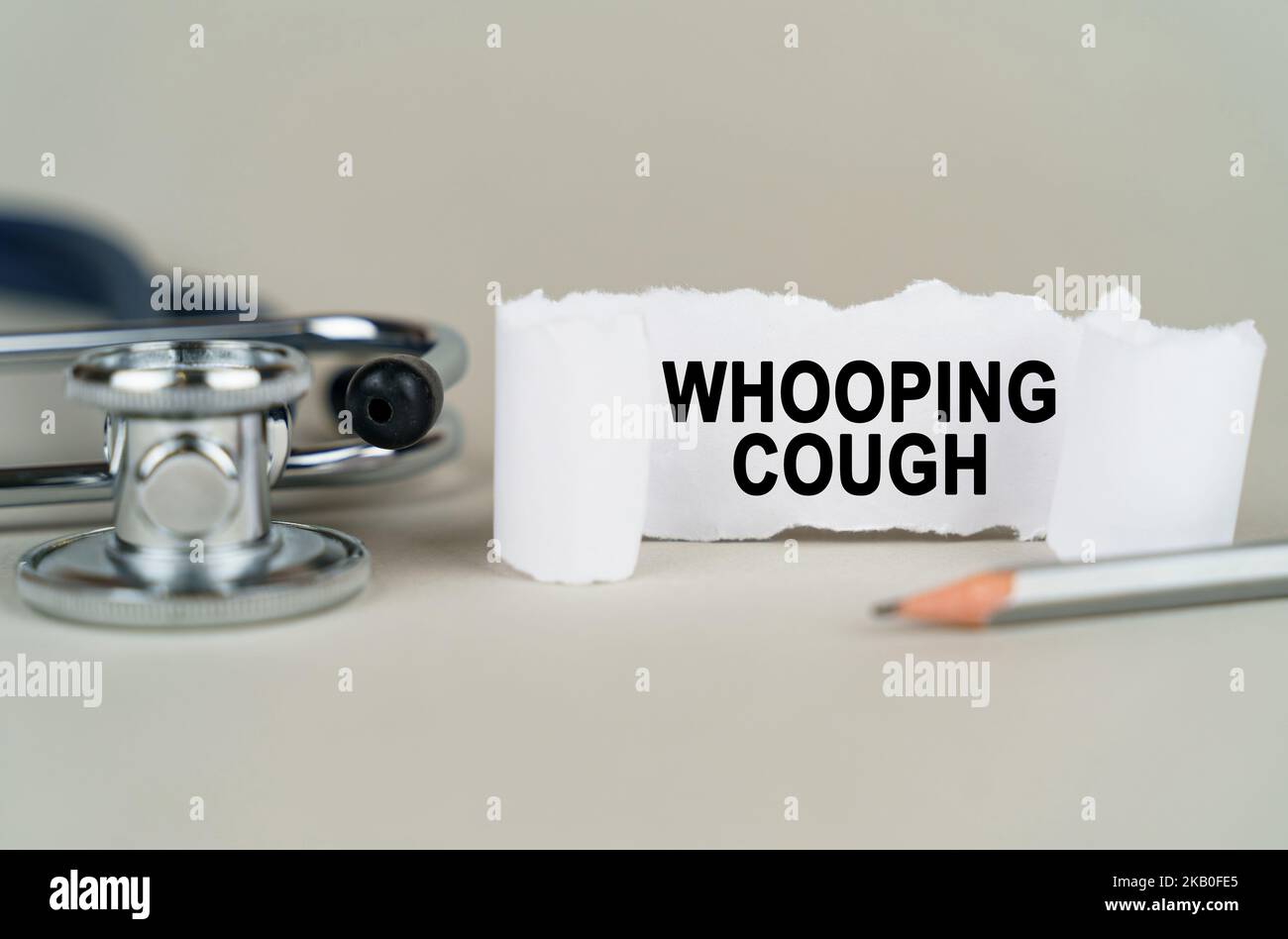 Medical concept. On a gray background, a stethoscope, a pencil and a ...