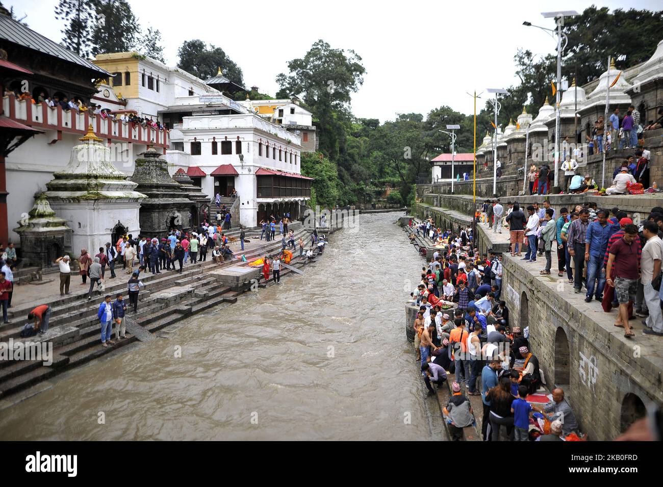 Nepalese devotees arrive bank of Bagmati river to change “Doro” a ...