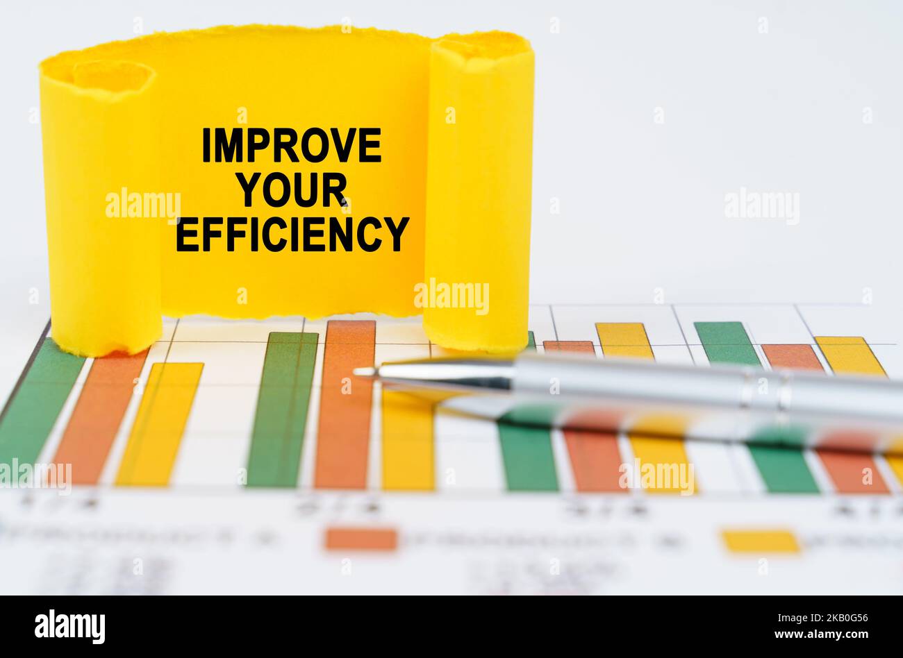 Business concept. On the business charts are a pen and a paper plate ...