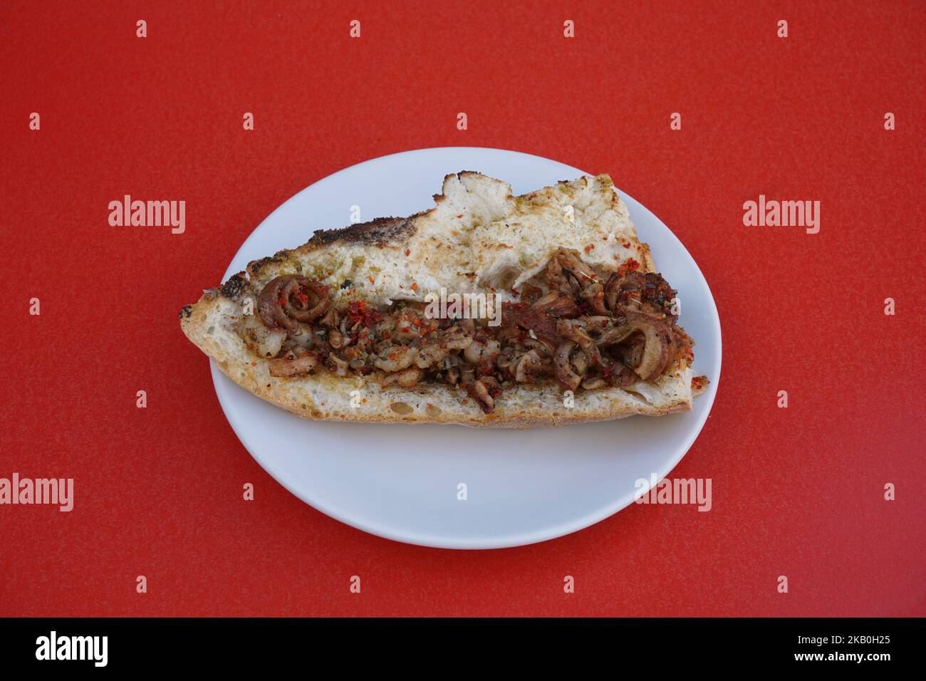 Kokorec between bread, Turkish street food Stock Photo - Alamy