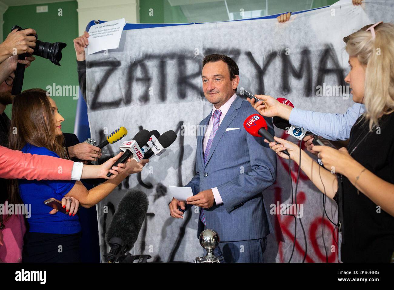 Maciej Mitera (KRS spokesman) during the press conference while a group ...