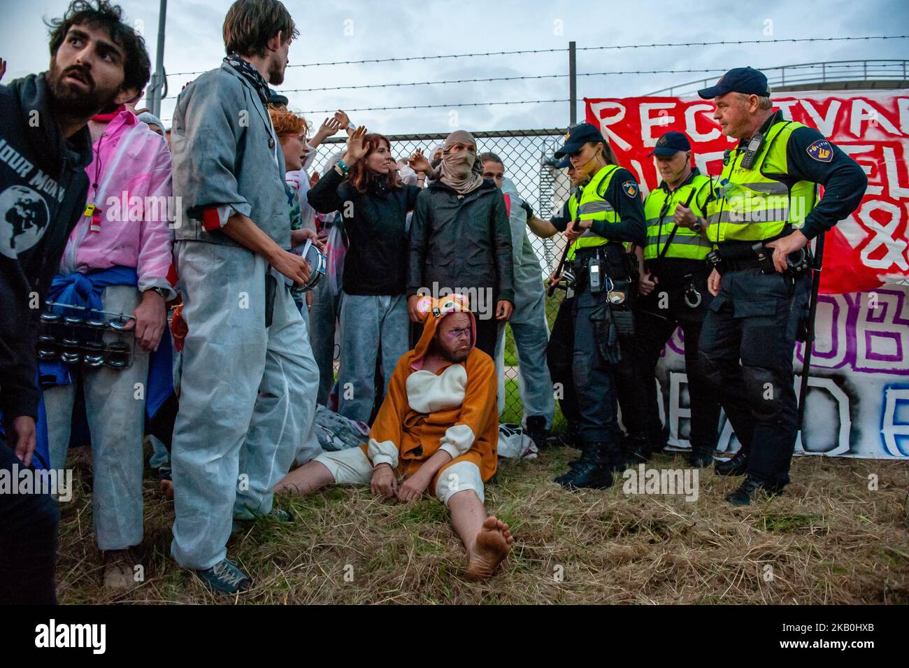 People protest in Farmsum, Netherlands, on August 28, 2018 in front of ...
