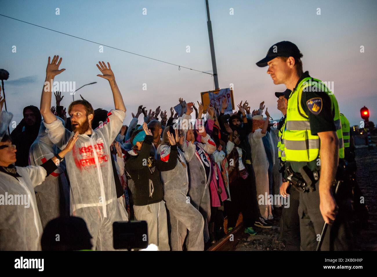 People protest in Farmsum, Netherlands, on August 28, 2018 in front of ...
