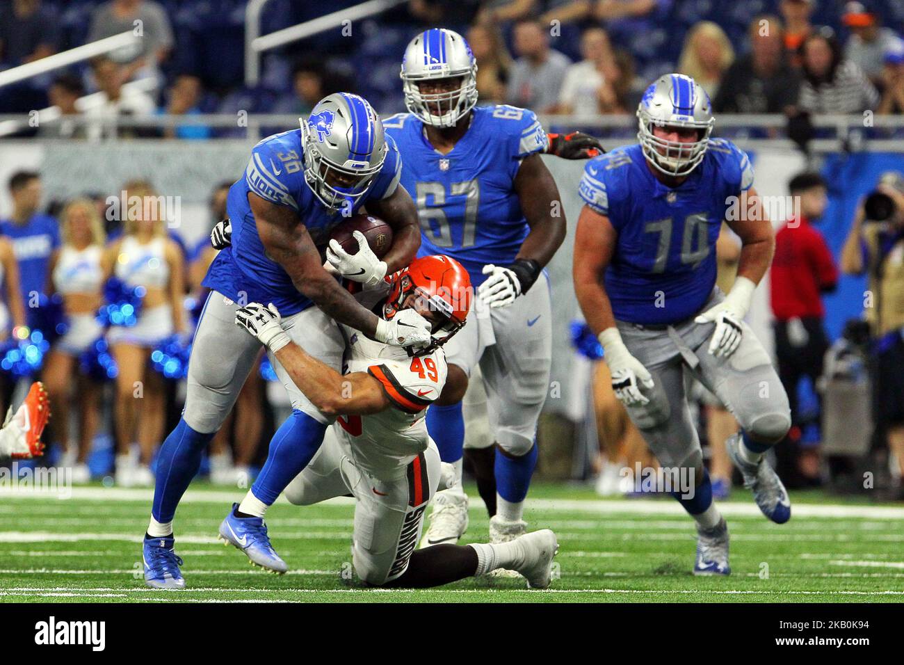 Detroit Lions Dwayne Washington is tackled by Cleveland Browns ...