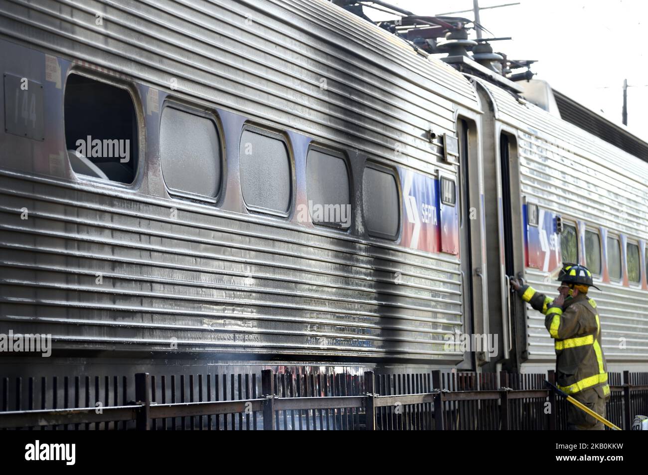 With a triple digits heat index, firefighters battle a fire on a ...