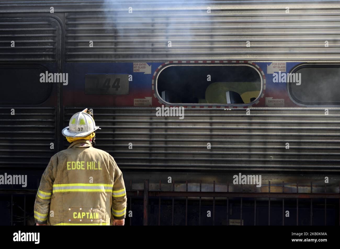With a triple digits heat index, firefighters battle a fire on a ...