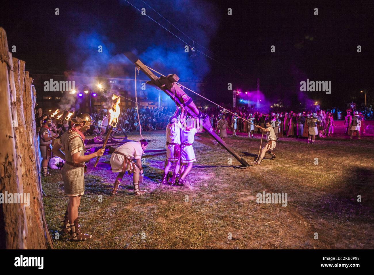 People raise a huge wooden cross during the crucifixion of cantabrian ...