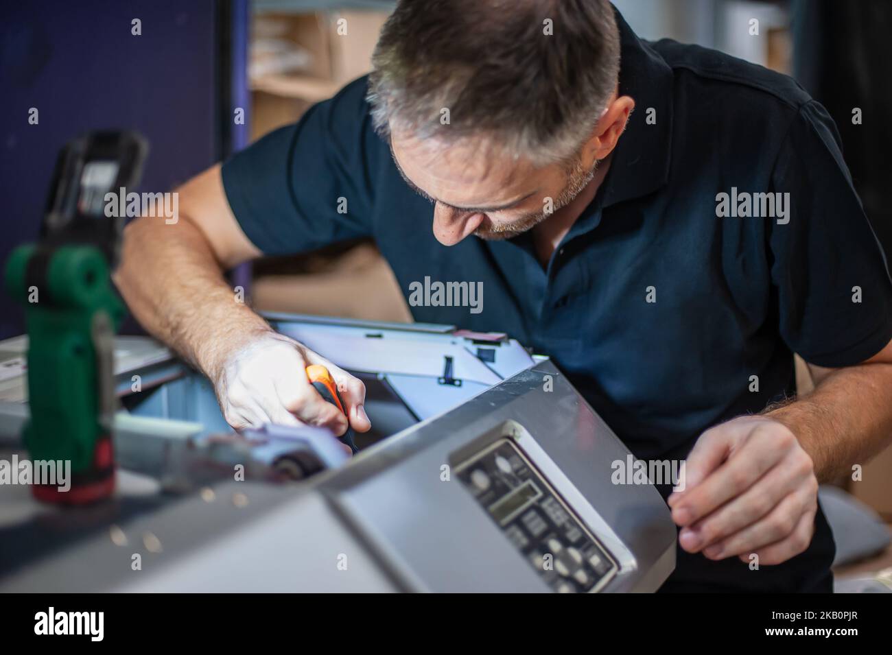 All machines nead maintains. Professional technician troubleshooting ...